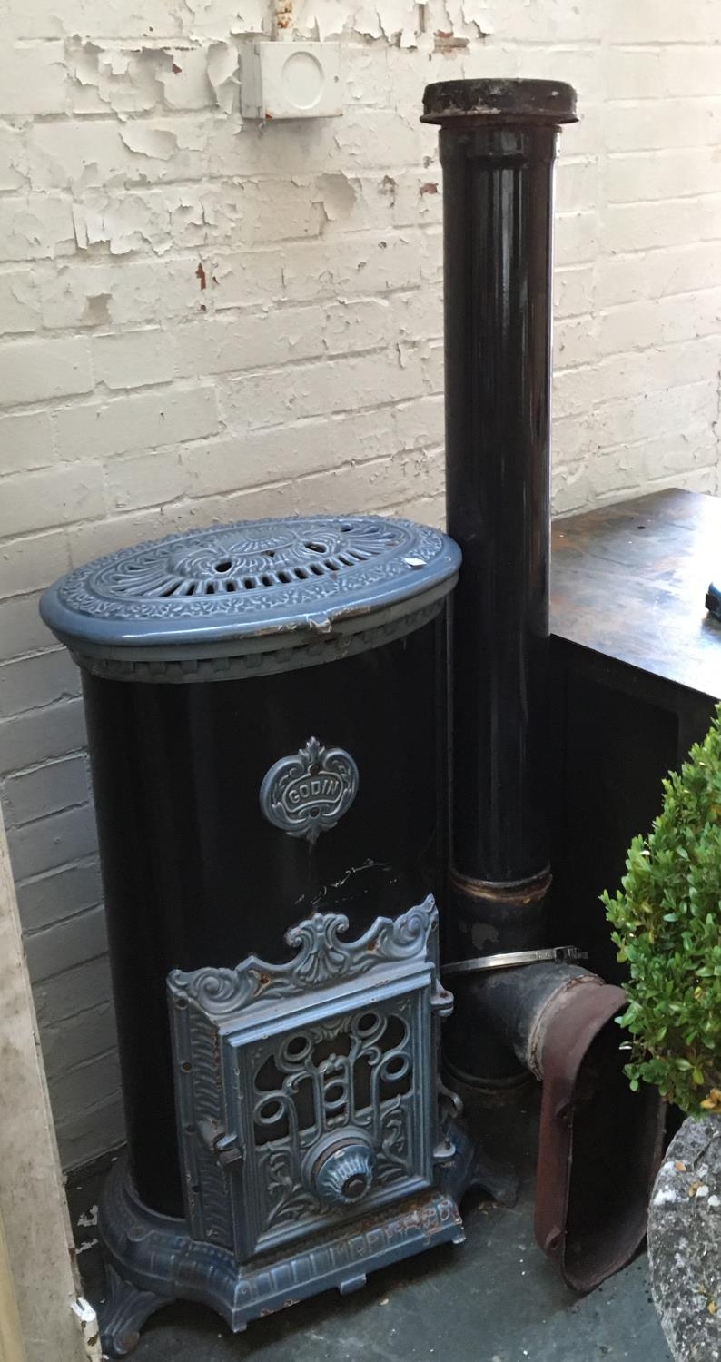 A French Godin enamelled stove, approx. 94cmH, with flue