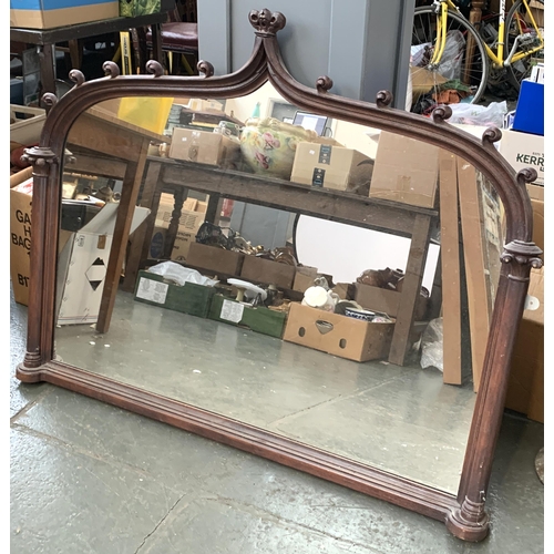 A cast resin oak grained mirror, with scrolling finials abov... | Barnebys