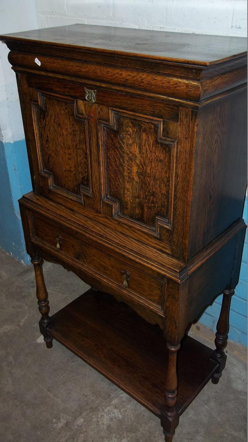 AN ANTIQUE NARROW OAK DROP DOWN WRITING DESK BUREAU