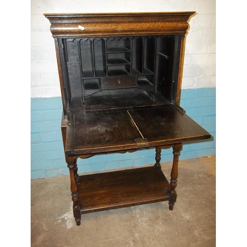 AN ANTIQUE NARROW OAK DROP DOWN WRITING DESK BUREAU
