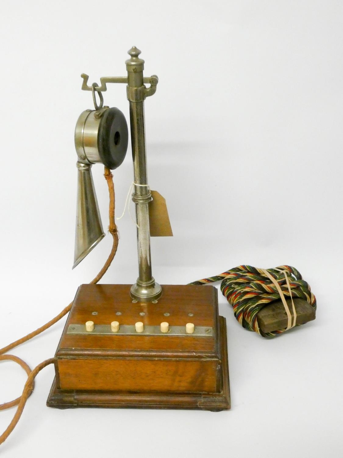 An old desktop horn type telephone