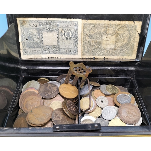 Cash Tin containing Coins.