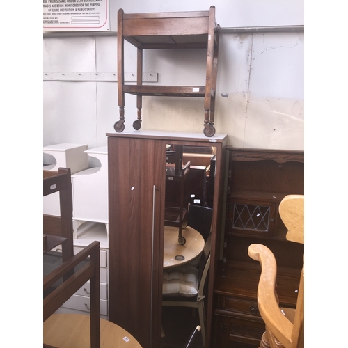 A modern wardrobe and an oak trolley | Barnebys