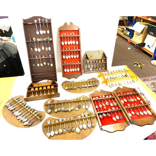 Large selection of souvenir spoons and display racks