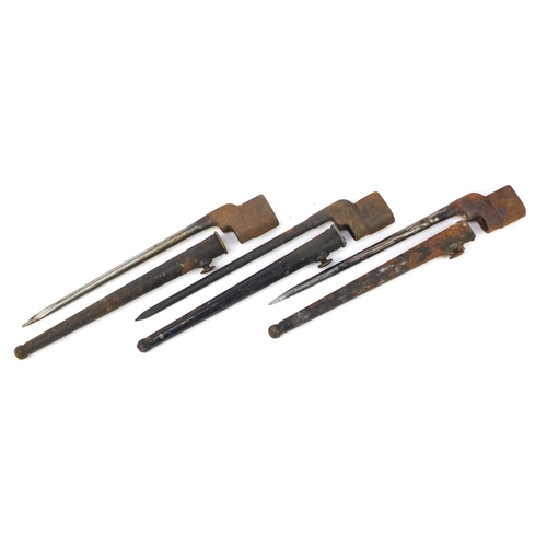Three British military socket bayonets with scabbards, each ... | Barnebys
