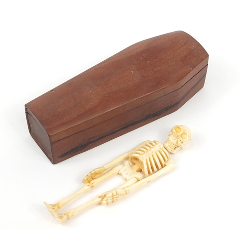 Japanese carved wood coffin with bone skeleton, the coffin with inset ...