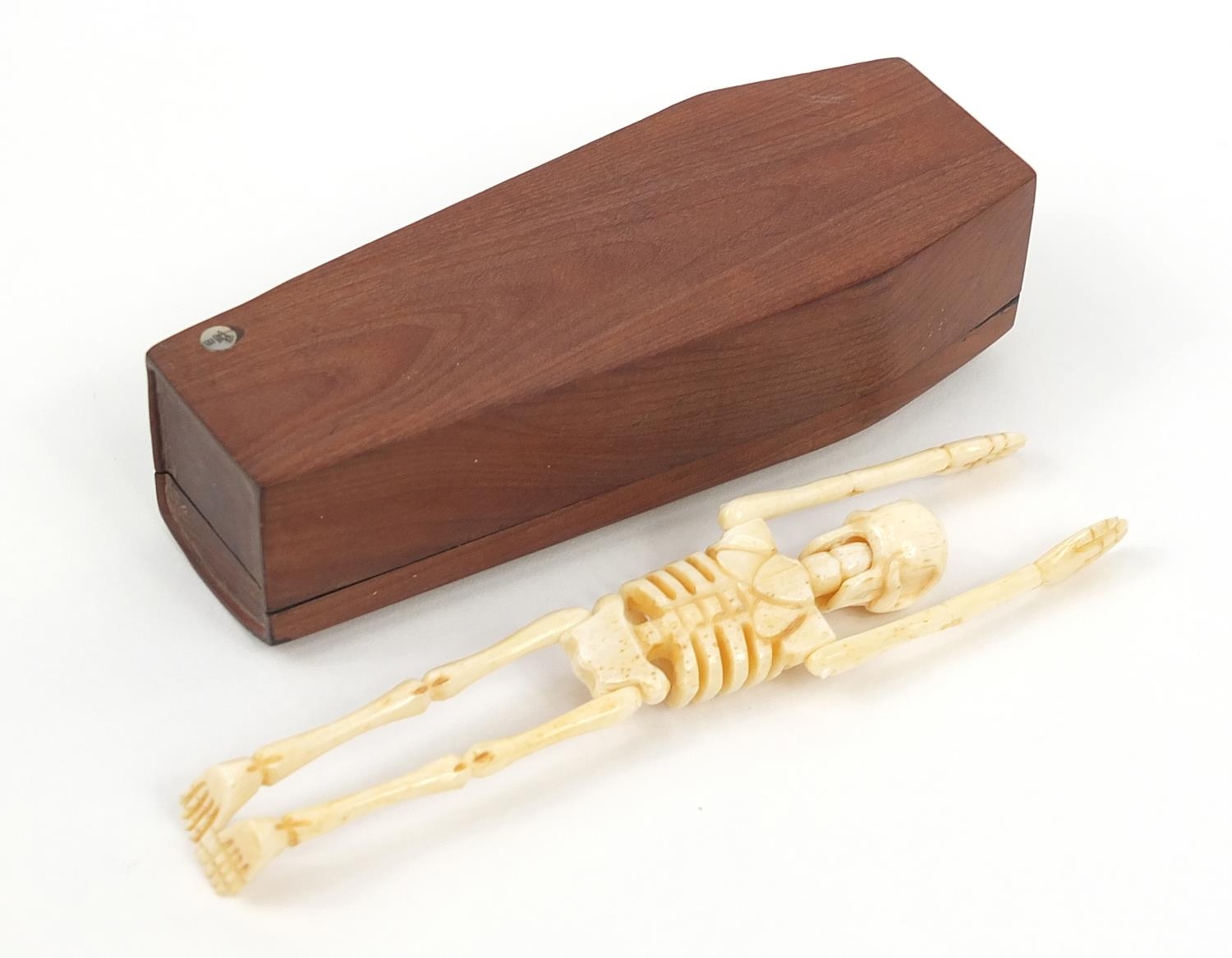 Japanese carved wood coffin with bone skeleton, the coffin with inset ...
