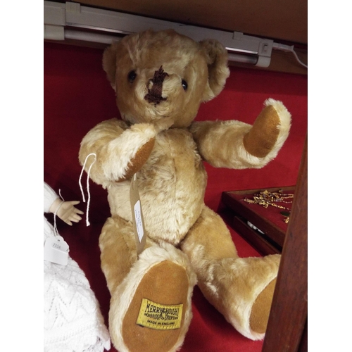 A MerryThought teddy bear with original label
