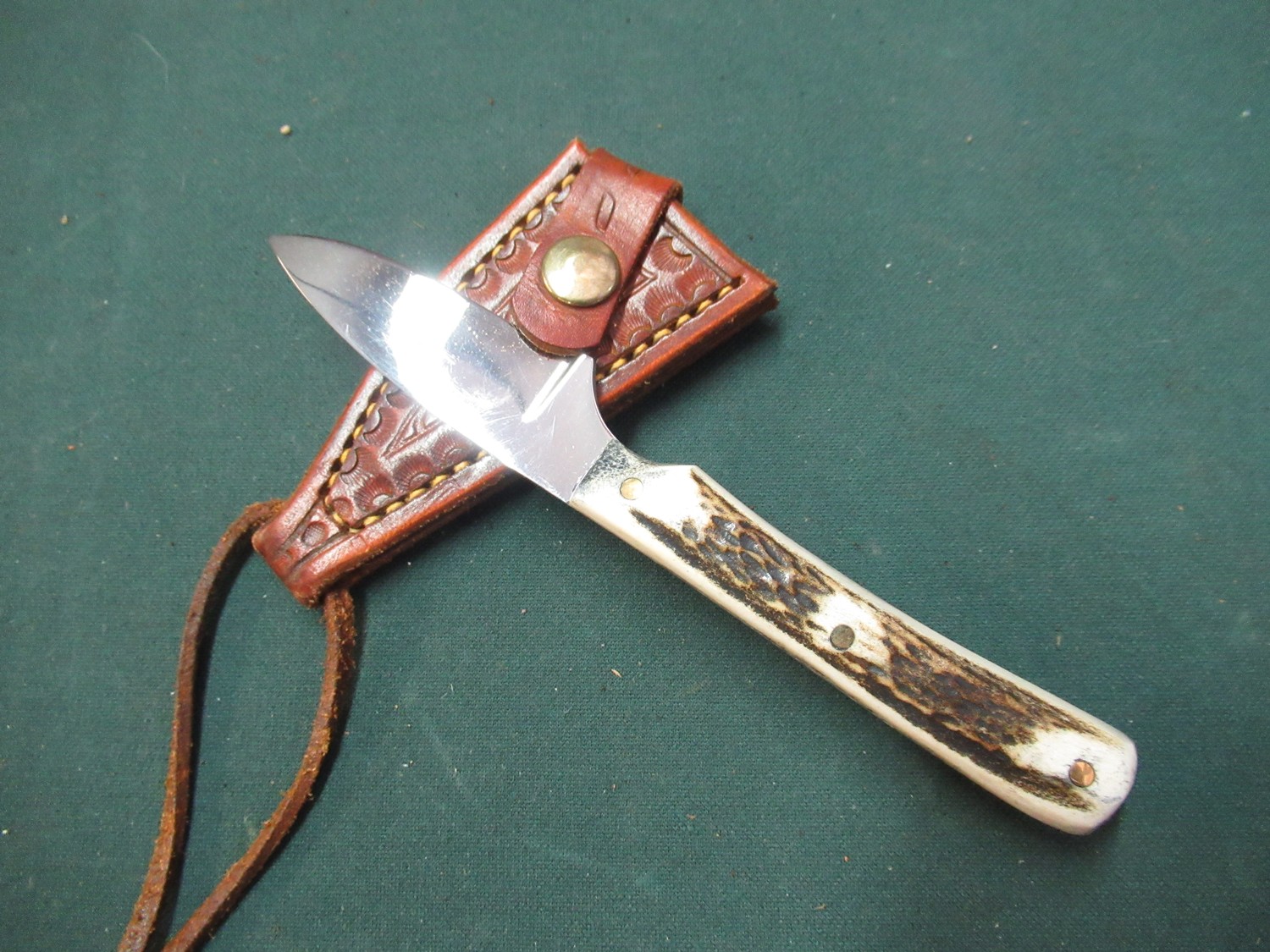 Small sheath knife with 2 1/4inch blade - auctions & price archive