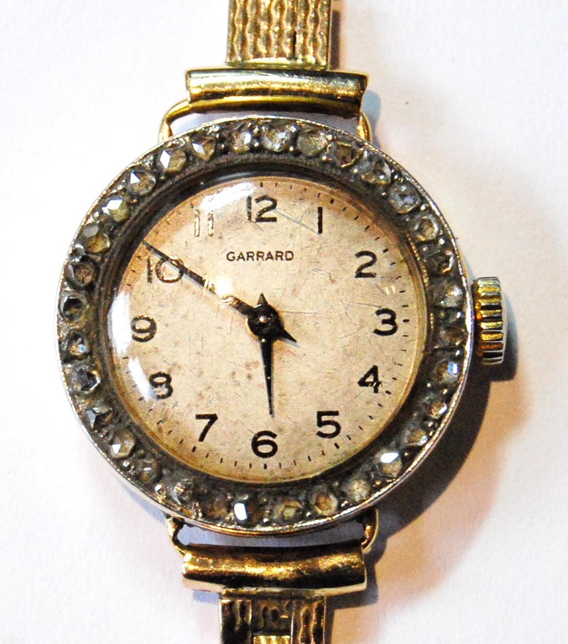 Garrard lady's 18ct gold watch with diamond-set bezel, 1919, movement ...