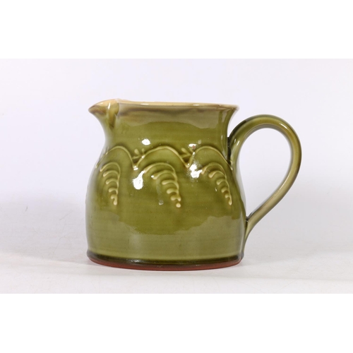 Wetheriggs of Penrith green glazed pottery jug, 14cm tall. | Barnebys