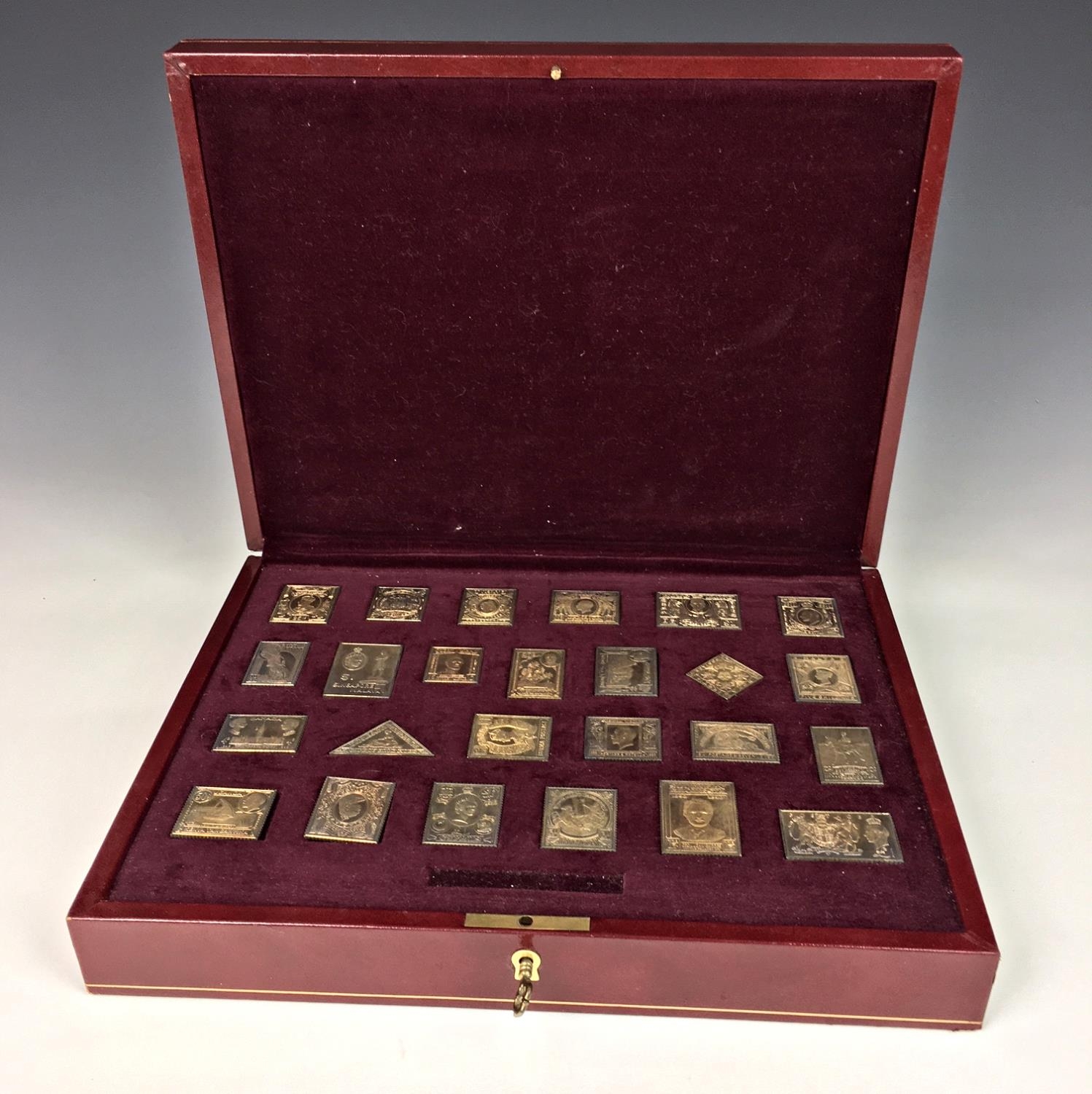 The Empire Collection of twenty-five silver gilt stamps, by Hallmark ...