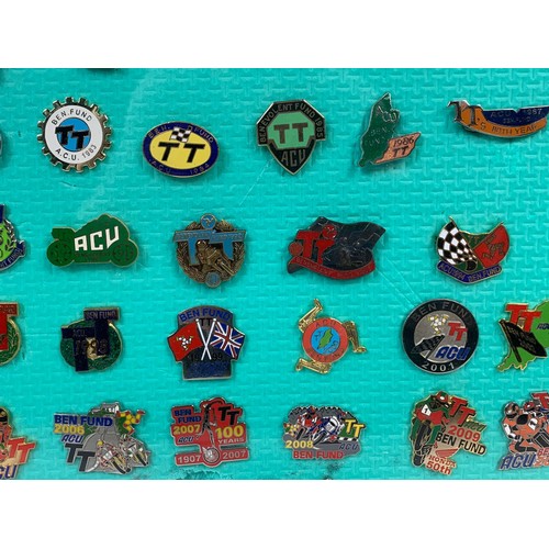 A collection of framed TT racing badges. Frame measures 36 x 36cm