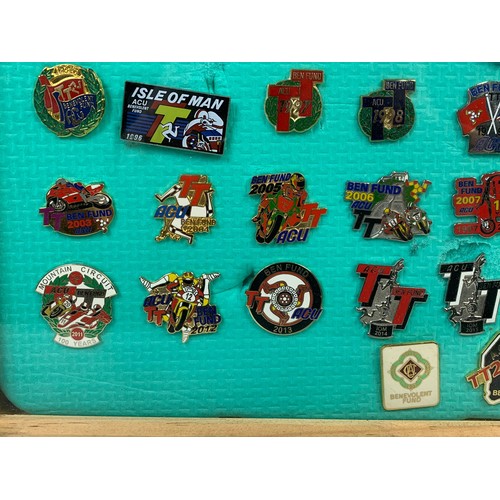 A collection of framed TT racing badges. Frame measures 36 x 36cm