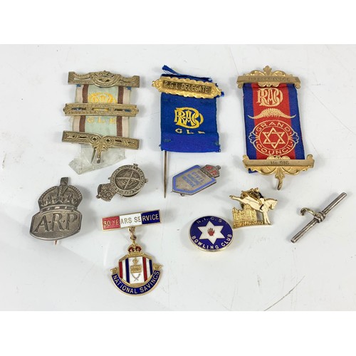 A collection of badges.