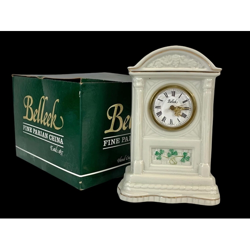 A Belleek pottery mantle clock with box. Clock measures 19.5cm tall